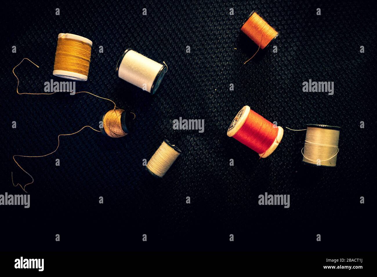 Colorful various spools of thread from sewing supplies Stock Photo - Alamy