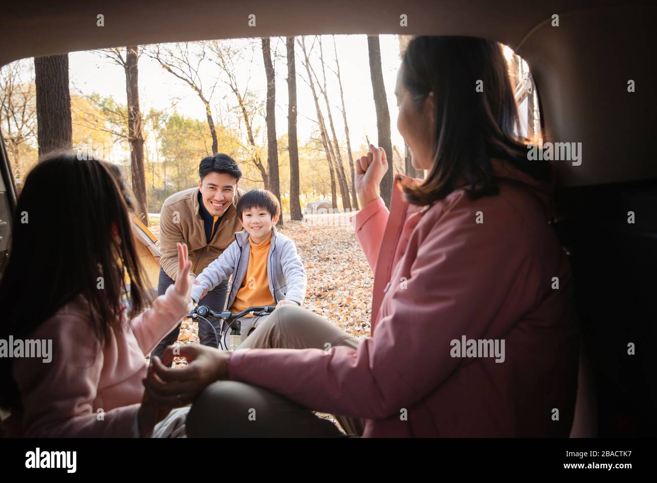 Happy family in the outdoor outing Stock Photo - Alamy