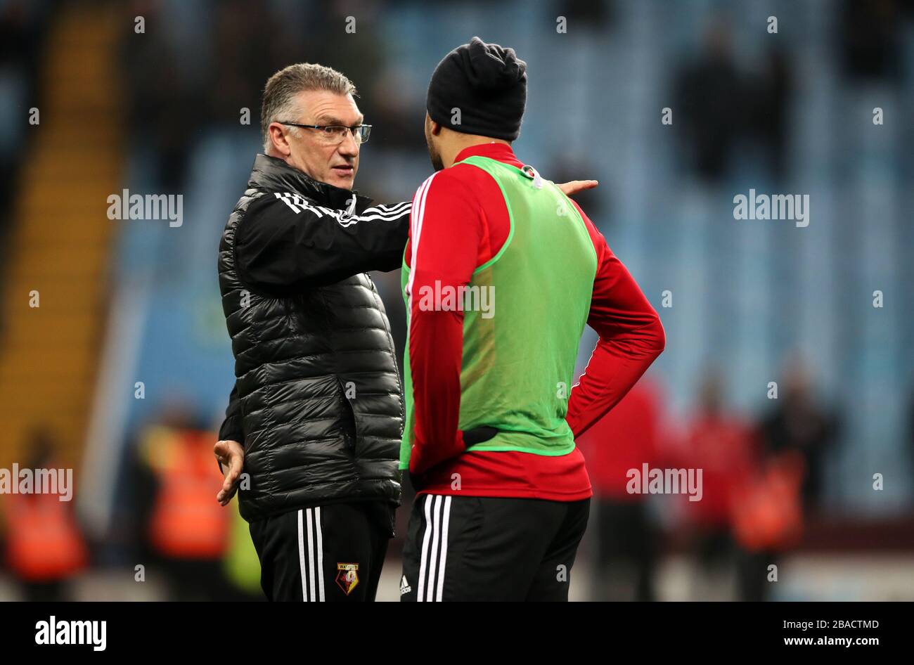 Watford manager Nigel Pearson speaks to team-mate Troy Deeney Stock ...