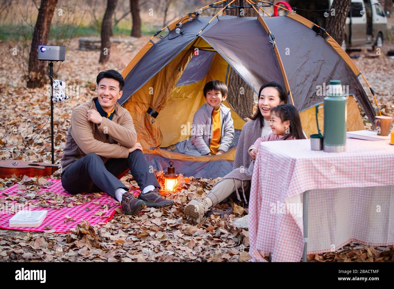 Happy family camping in the open air Stock Photo - Alamy