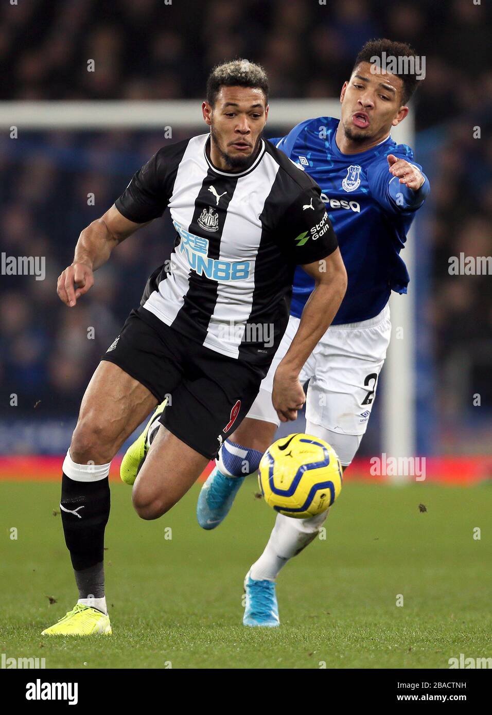 Newcastle United's Joelinton (left) and Everton's Mason Holgate battle ...