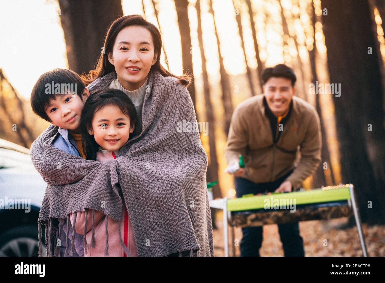 Happy family in the outdoor outing Stock Photo - Alamy