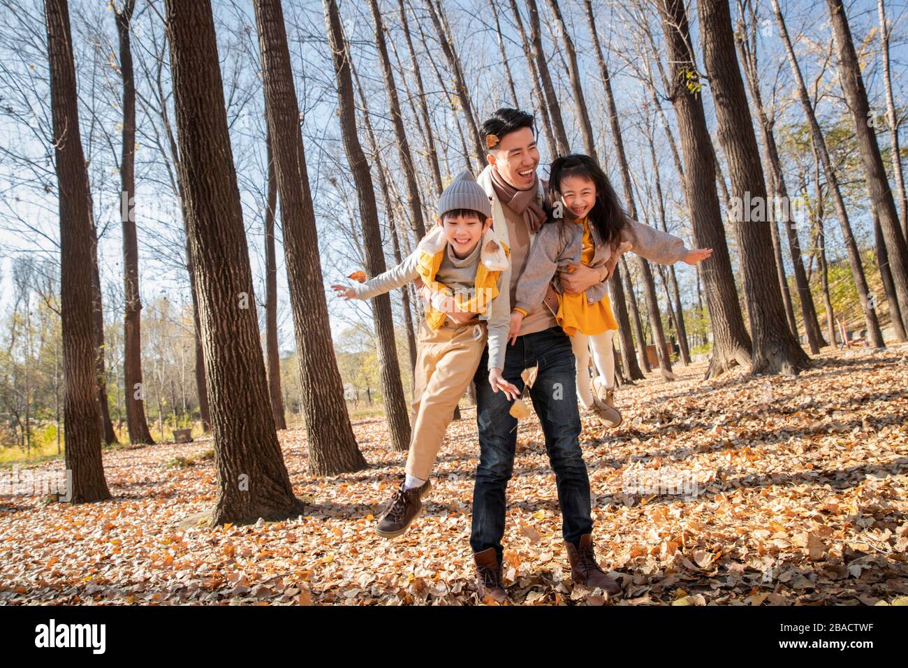 Happy family playing outside Stock Photo - Alamy