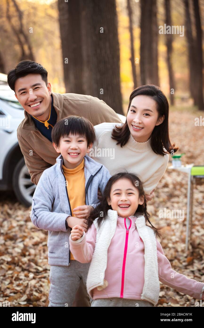 Happy family in the outdoor outing Stock Photo - Alamy