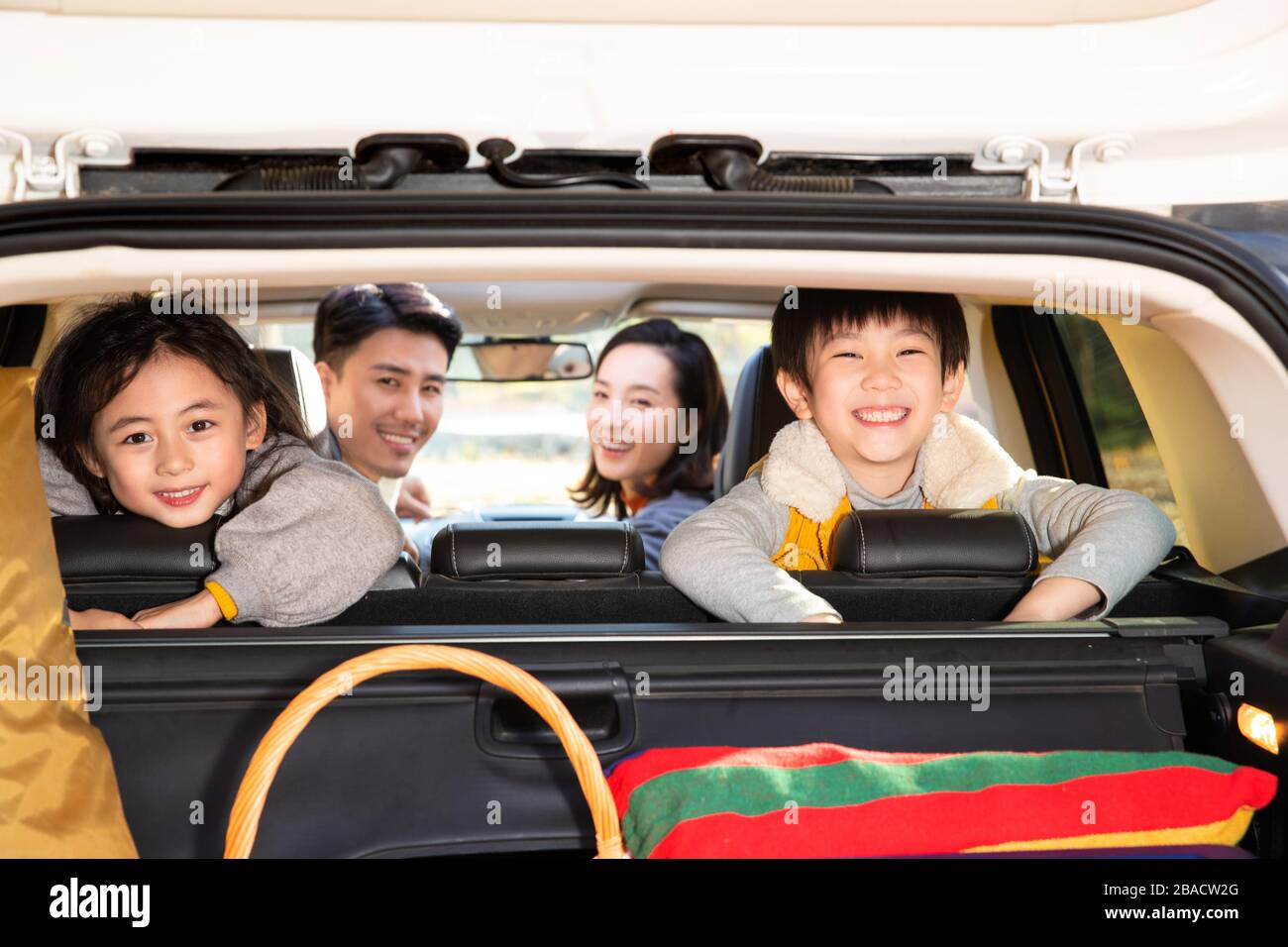 Happiness of a family of four towns Stock Photo - Alamy