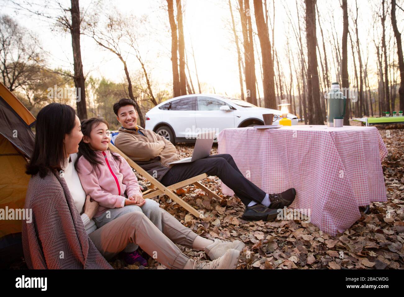 Happy family of three outdoor outing Stock Photo - Alamy