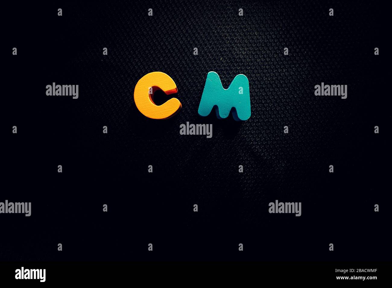 colorful centimeter metric labels on black background Stock Photo - Alamy