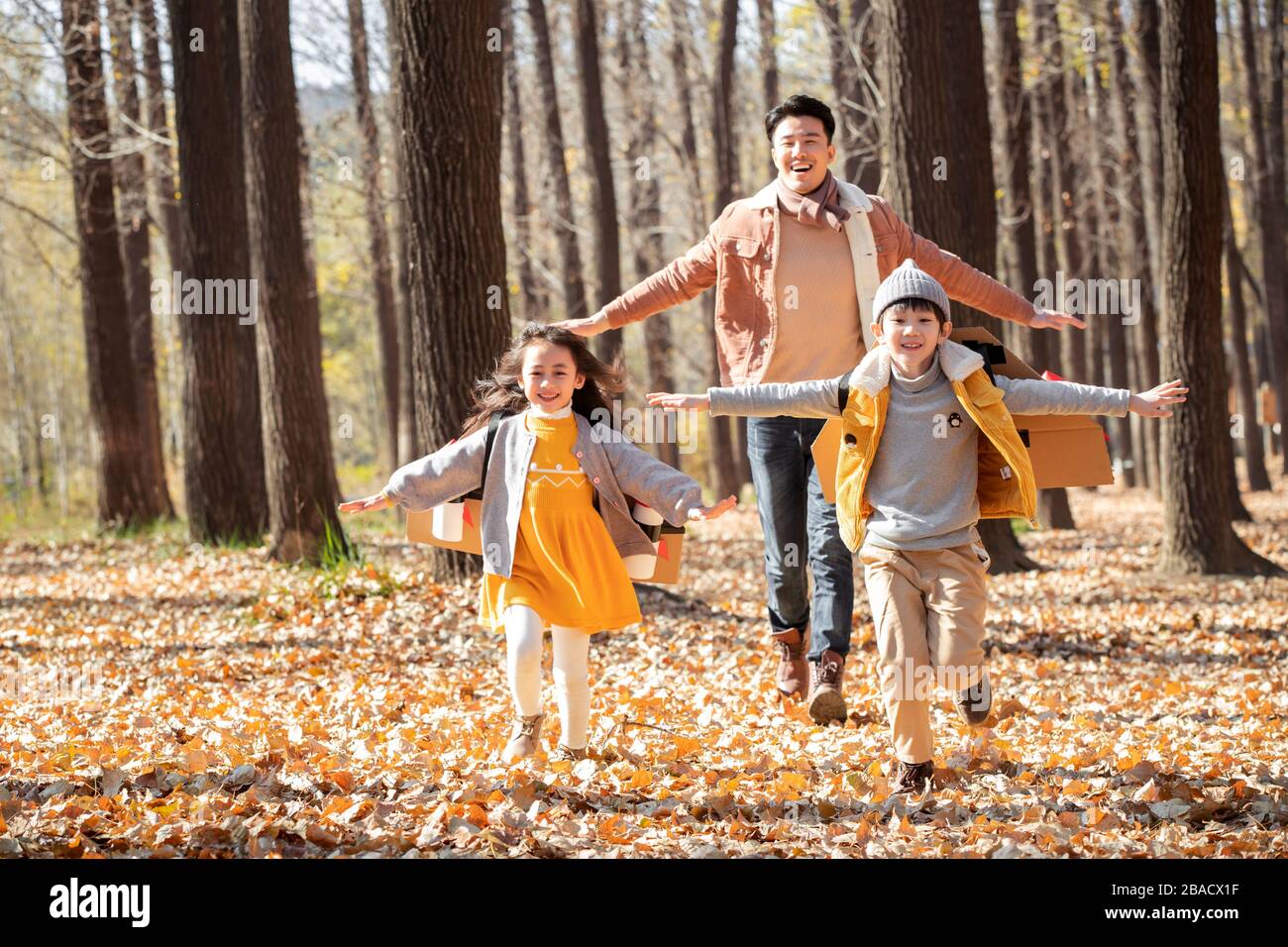 Happy family playing outside Stock Photo - Alamy