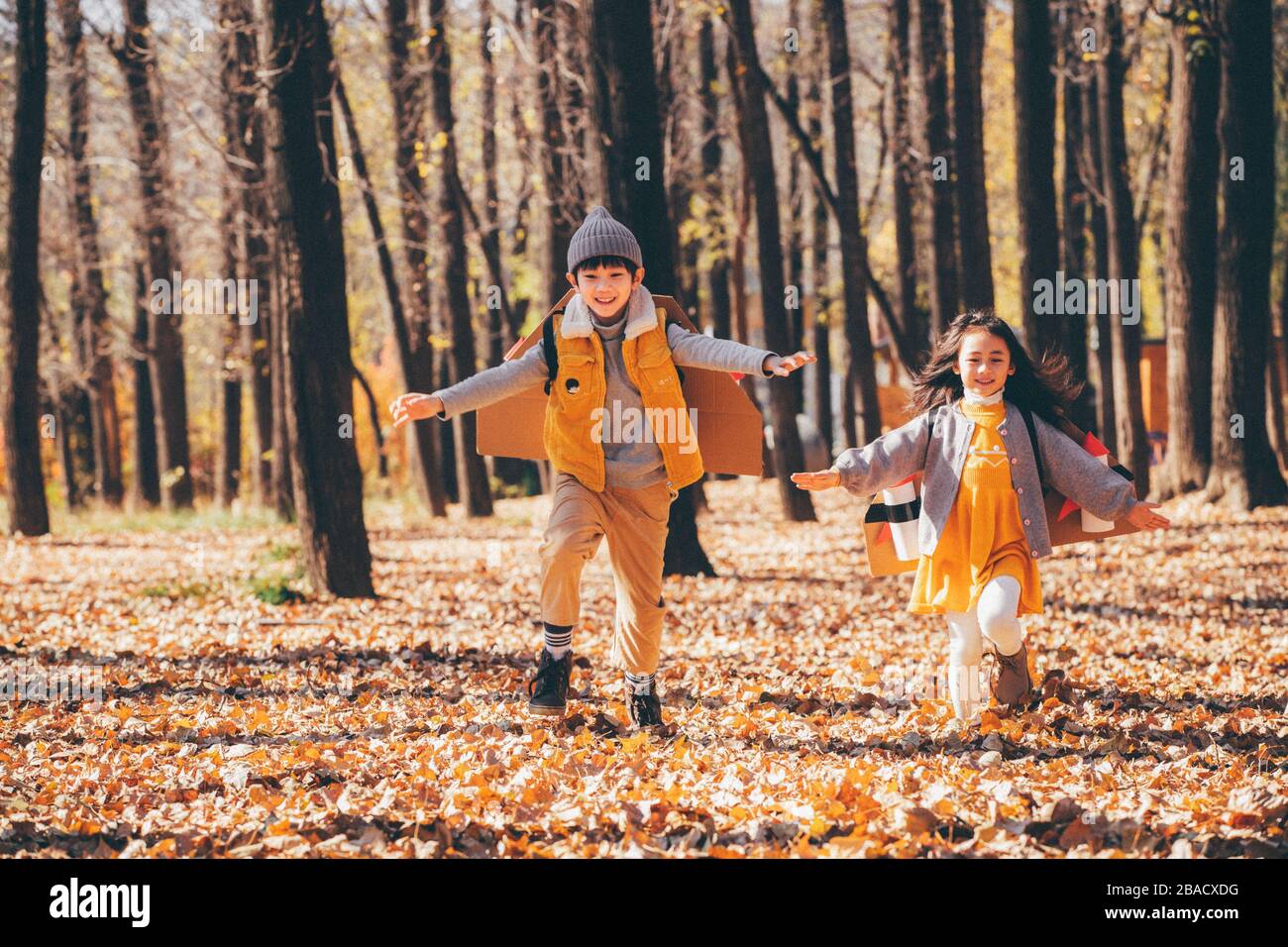 Happy children play outdoors Stock Photo - Alamy