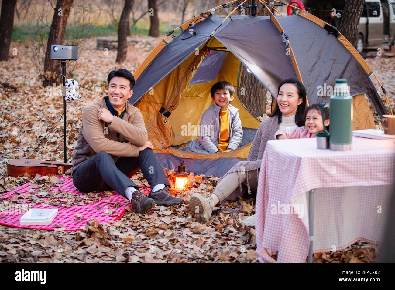 Happy family outdoor camping projection Stock Photo - Alamy
