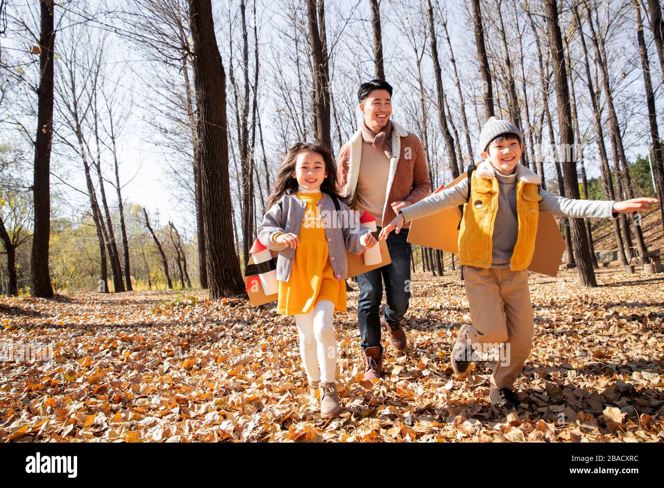 Happy father and the children play outdoors Stock Photo - Alamy