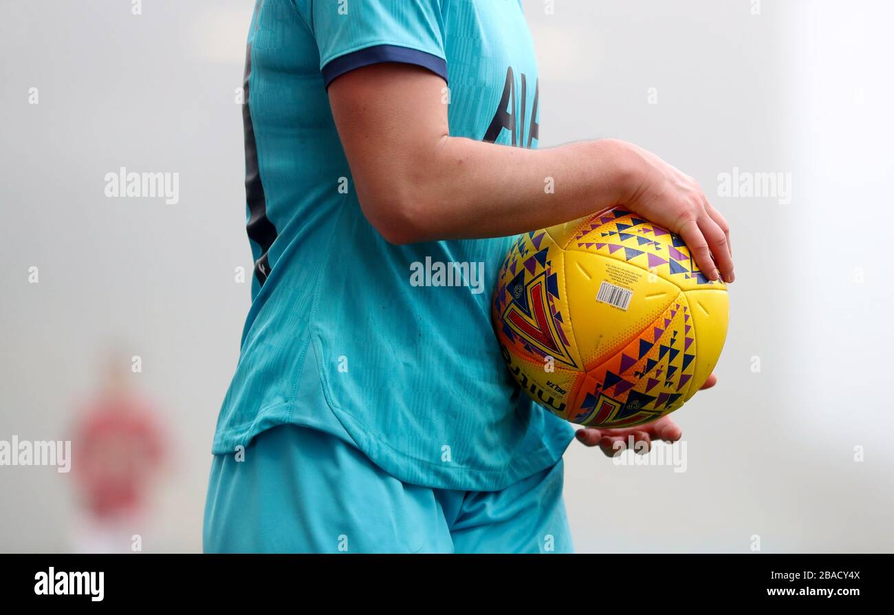 A Tottenham Hotspur players holds the match ball during the game Stock ...