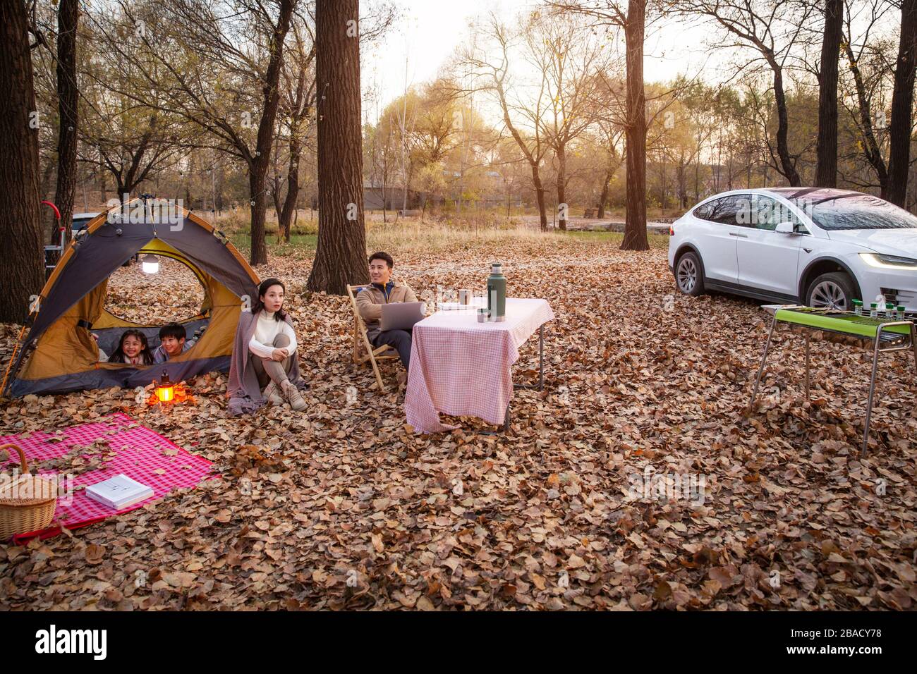 Happy family outing in the outdoor camping Stock Photo - Alamy