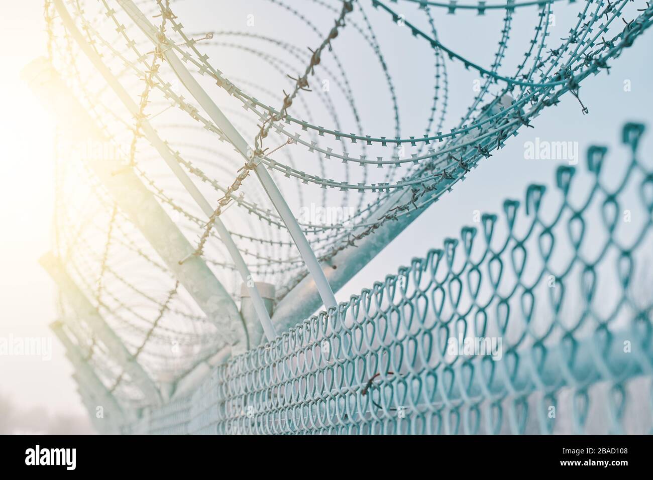 Border fence with barbed wire. Closing for quarantine. Maximum Security ...