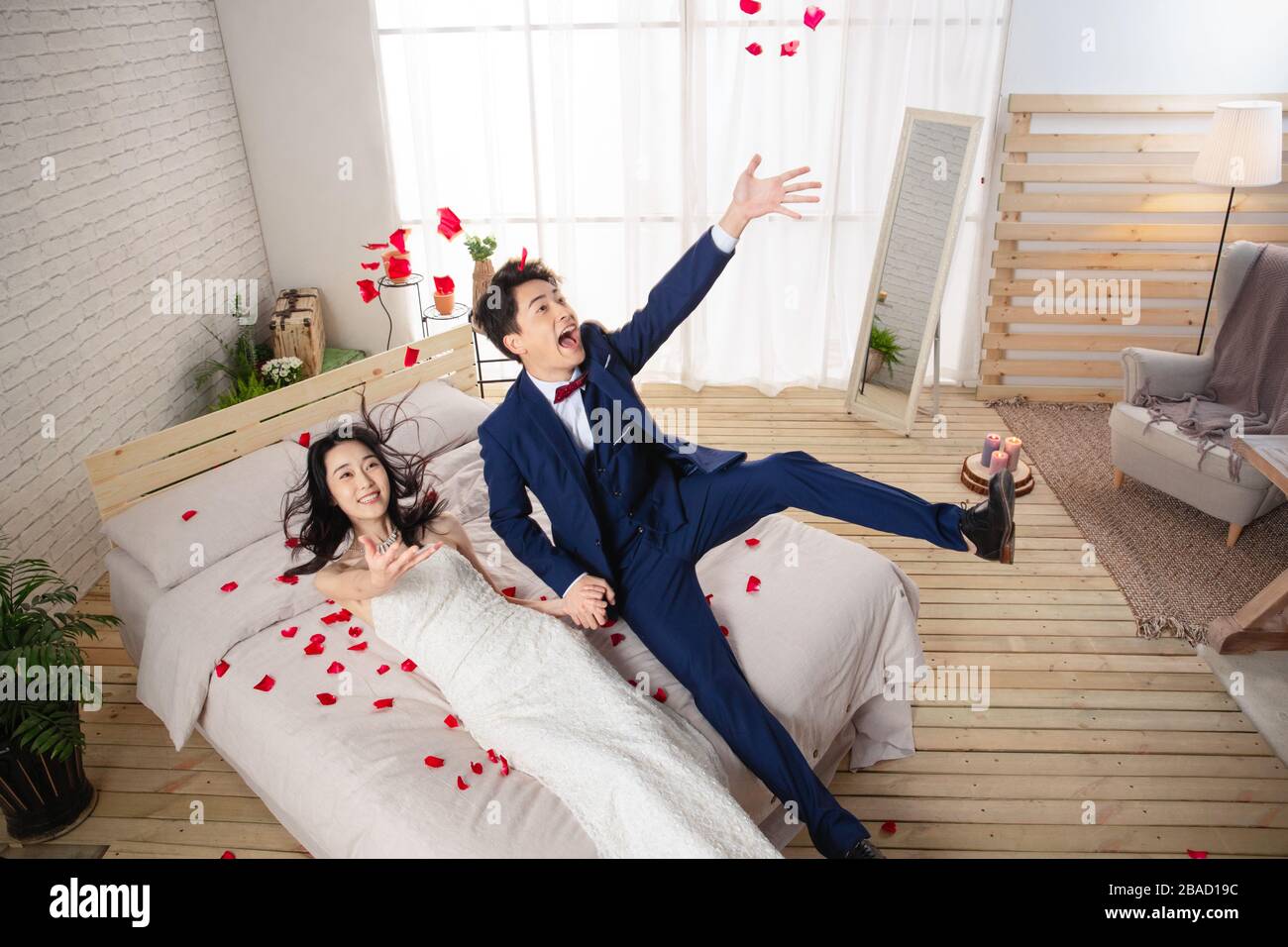 The excitement of newlyweds fell back on the bed Stock Photo - Alamy