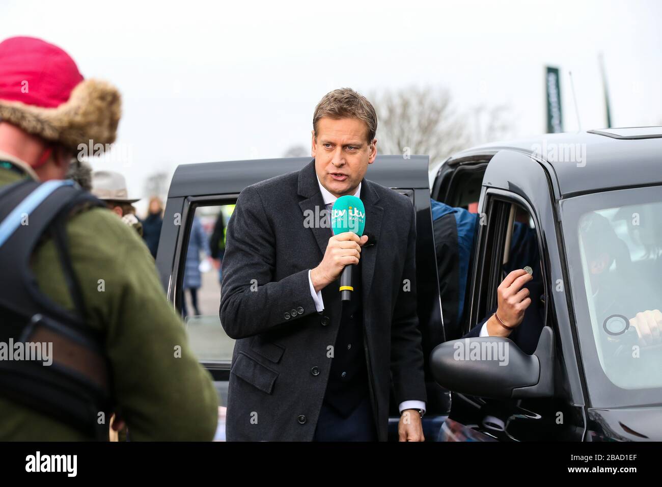 ITV's Ed Chamberlin during filming in a branded Cheltenham Festival ...