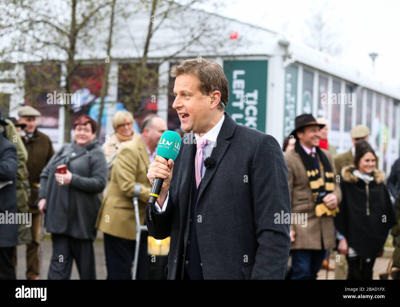 ITV's Ed Chamberlin during filming in a branded Cheltenham Festival ...