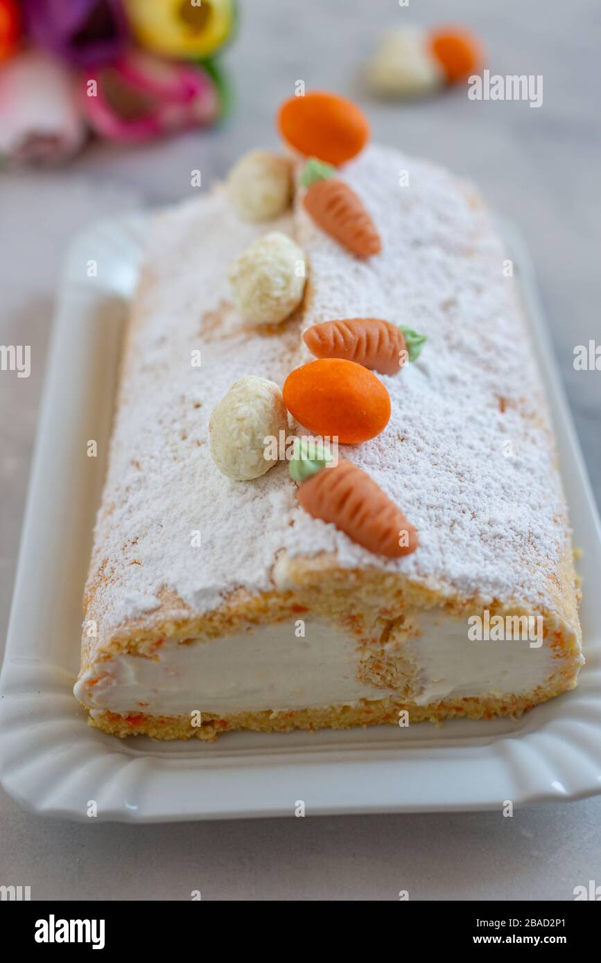 home made Easter sponge roll with carrots on a table Stock Photo - Alamy