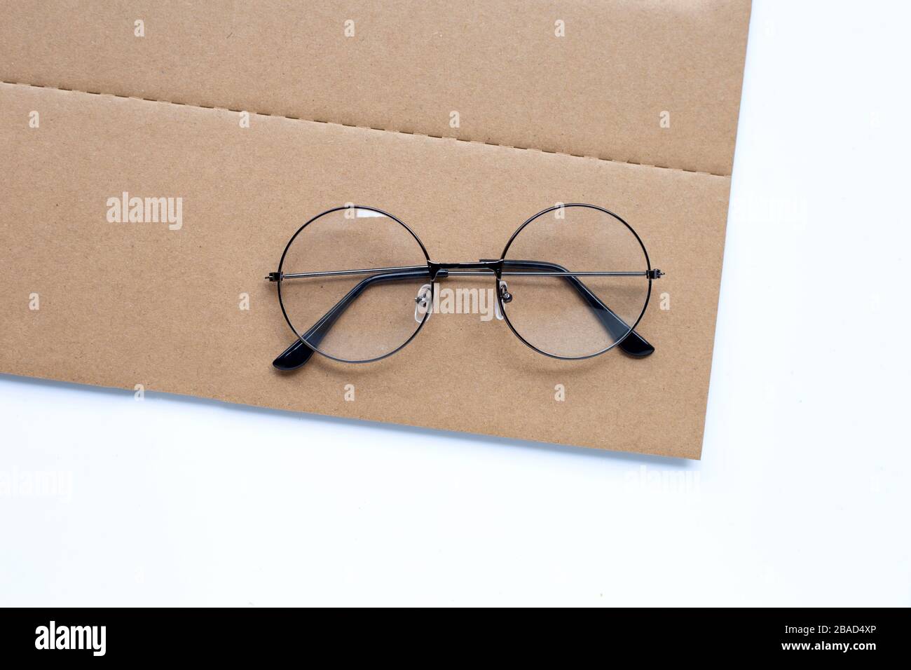 Eye Glasses on brown cardboard, white background. Copy space Stock ...