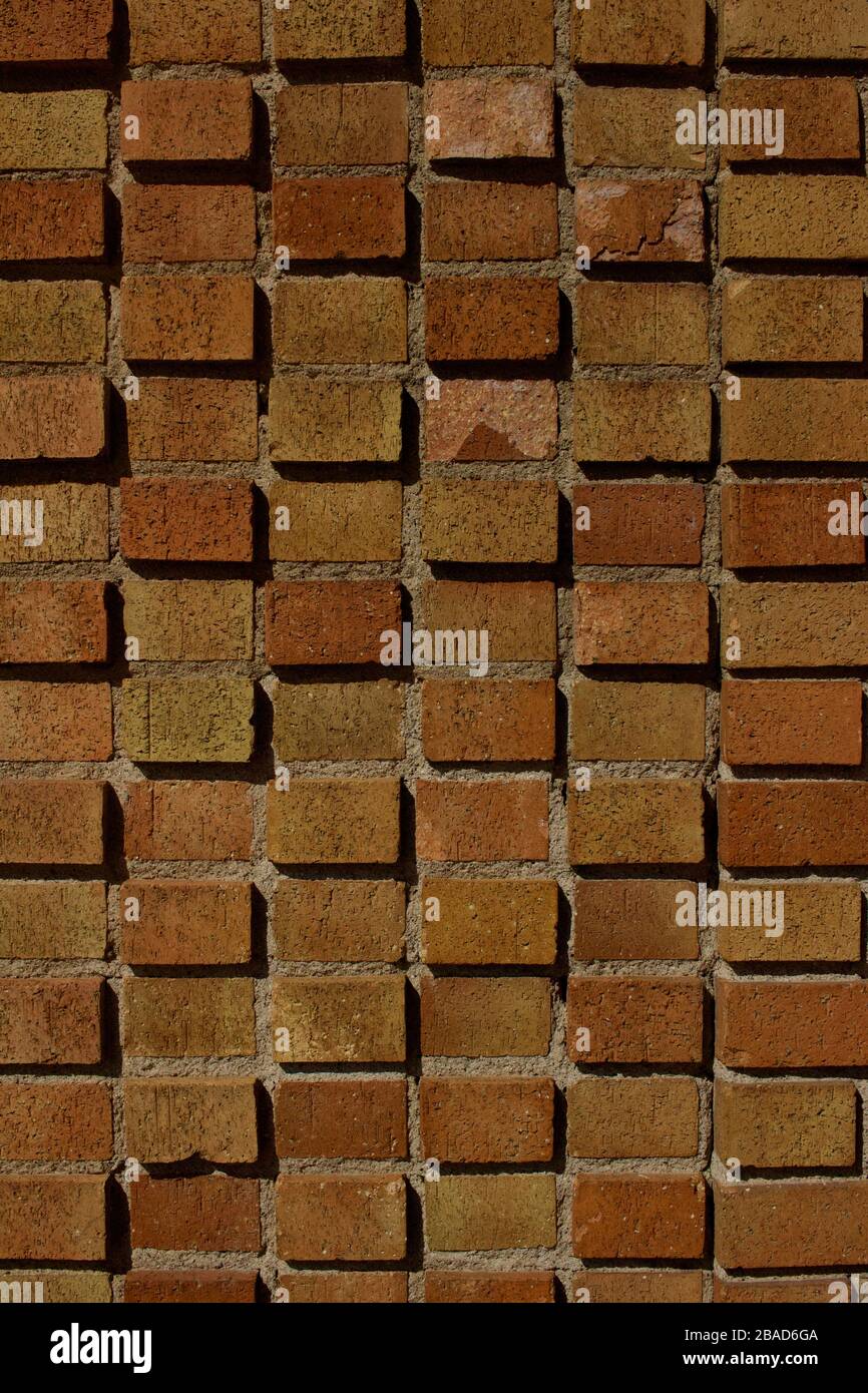 Vintage light brown brick wall texture background with protruding ...