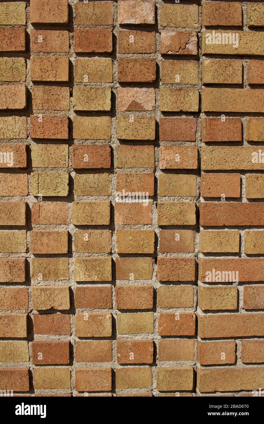 Vintage light brown brick wall texture background with protruding ...