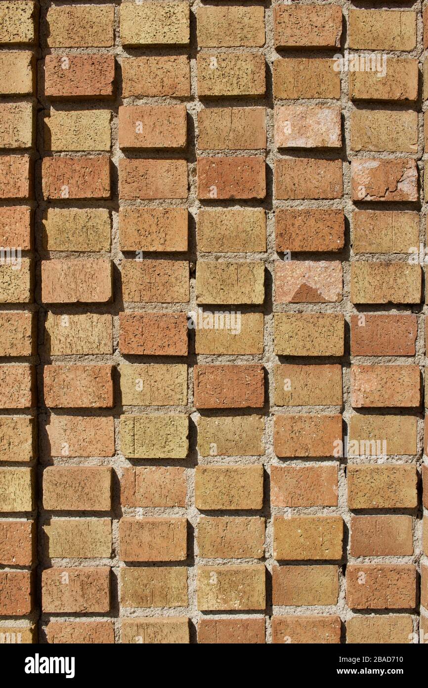 Vintage light brown brick wall texture background with protruding ...
