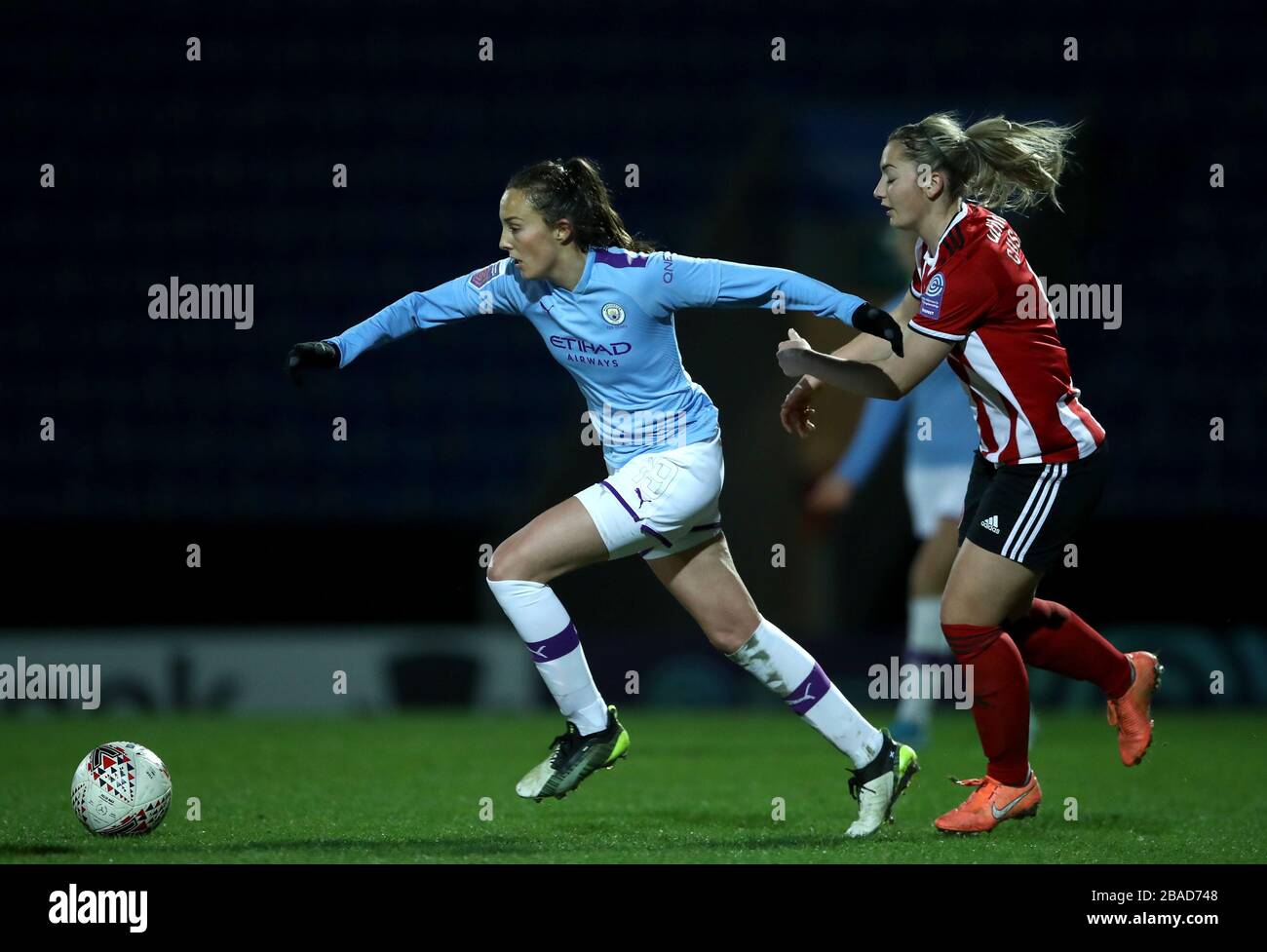 Manchester City's Caroline Weir (left) gets past Sheffield United's ...