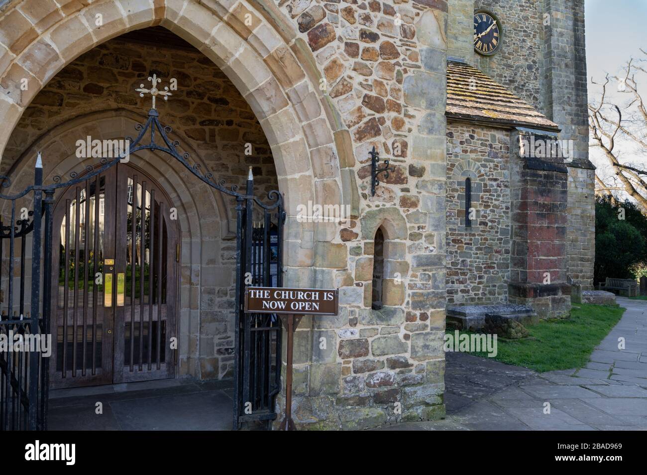 The entrance with "now open" sign to St Mary's church in Horsham, West ...
