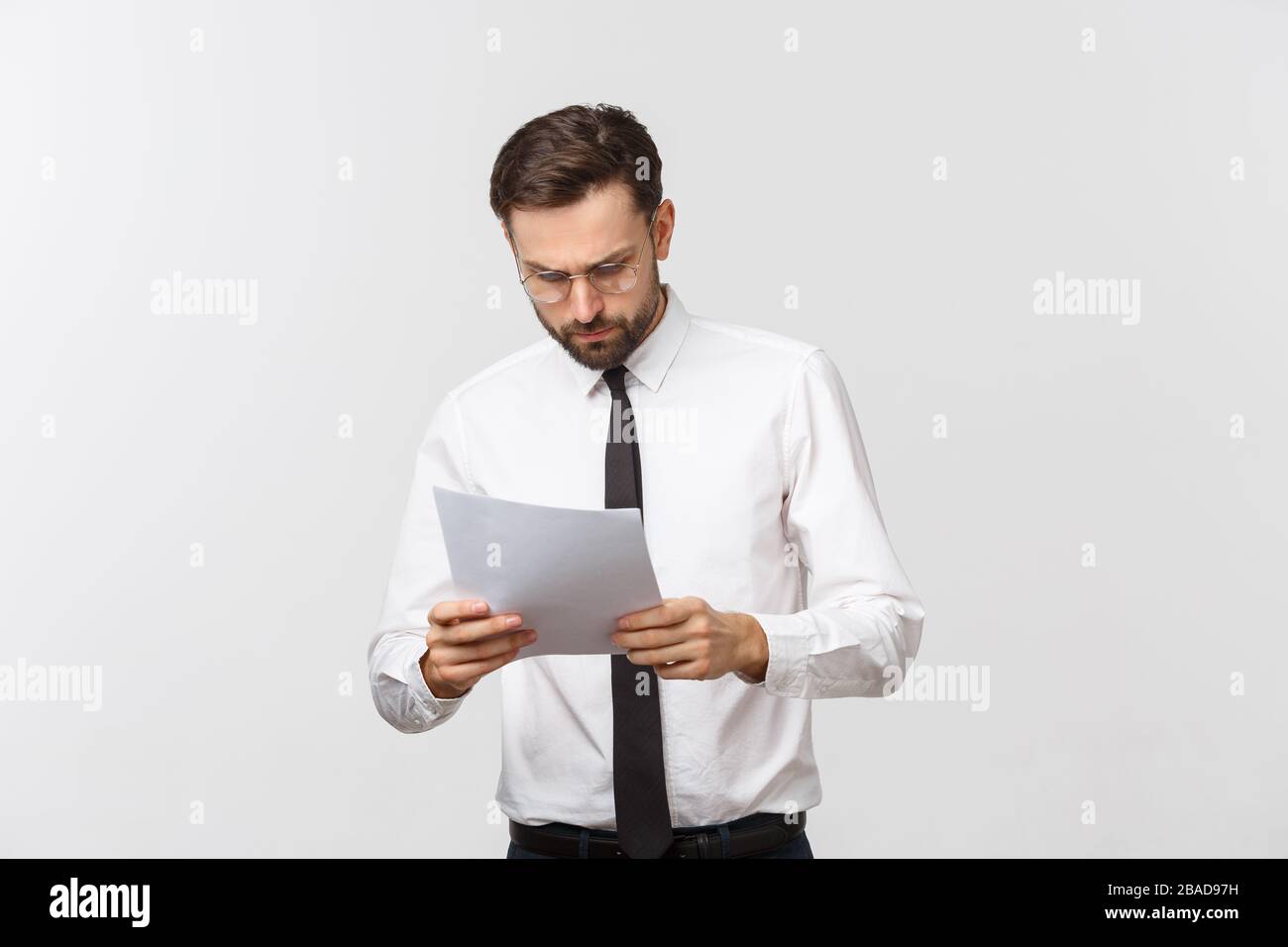young business man serious writing on clipboard, Handsome businessman ...