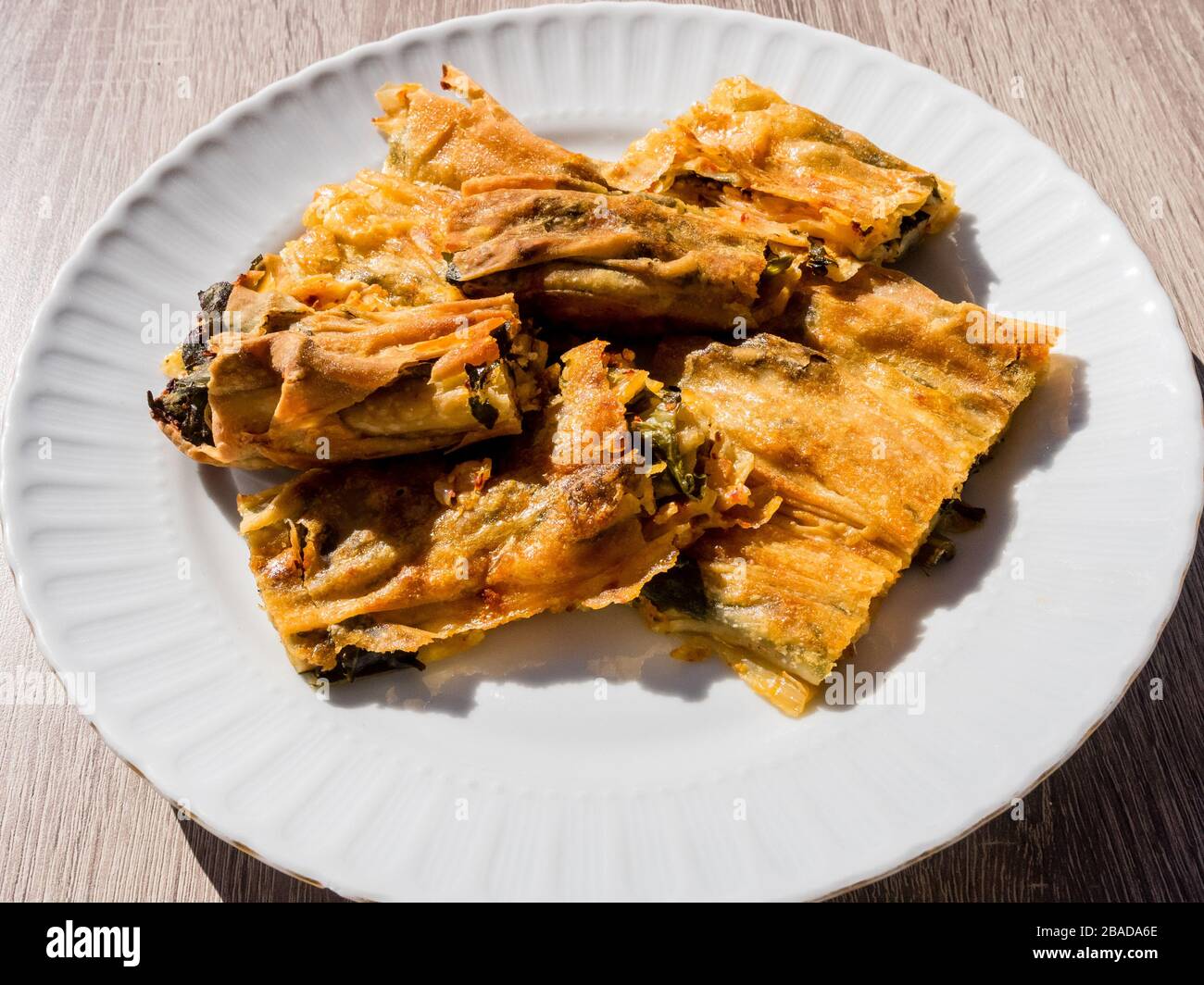 Turkish traditional borek with spinach and cheese Stock Photo - Alamy