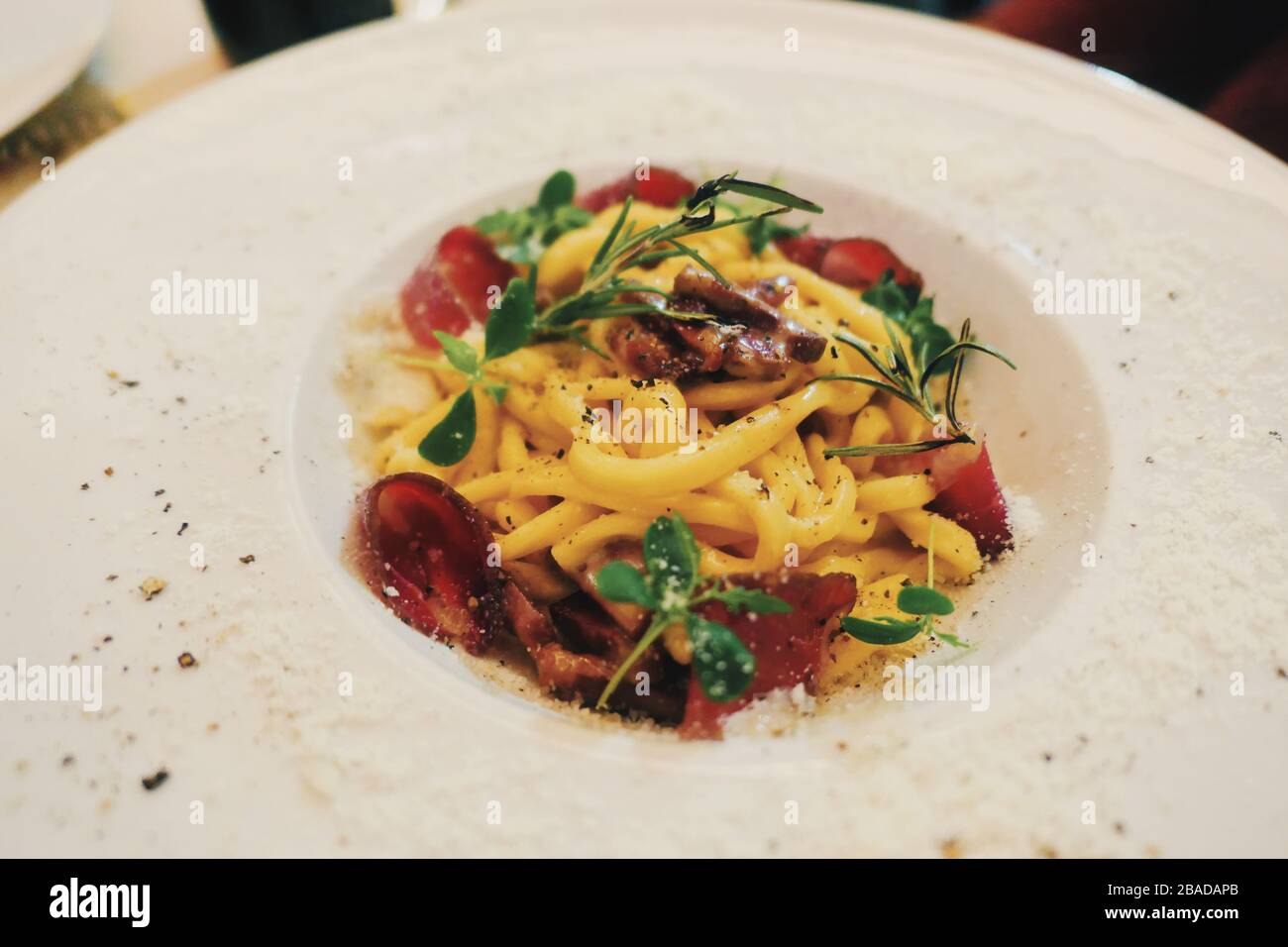 Italian high-end cuisine and fine dining, delicious pasta on a plate in ...