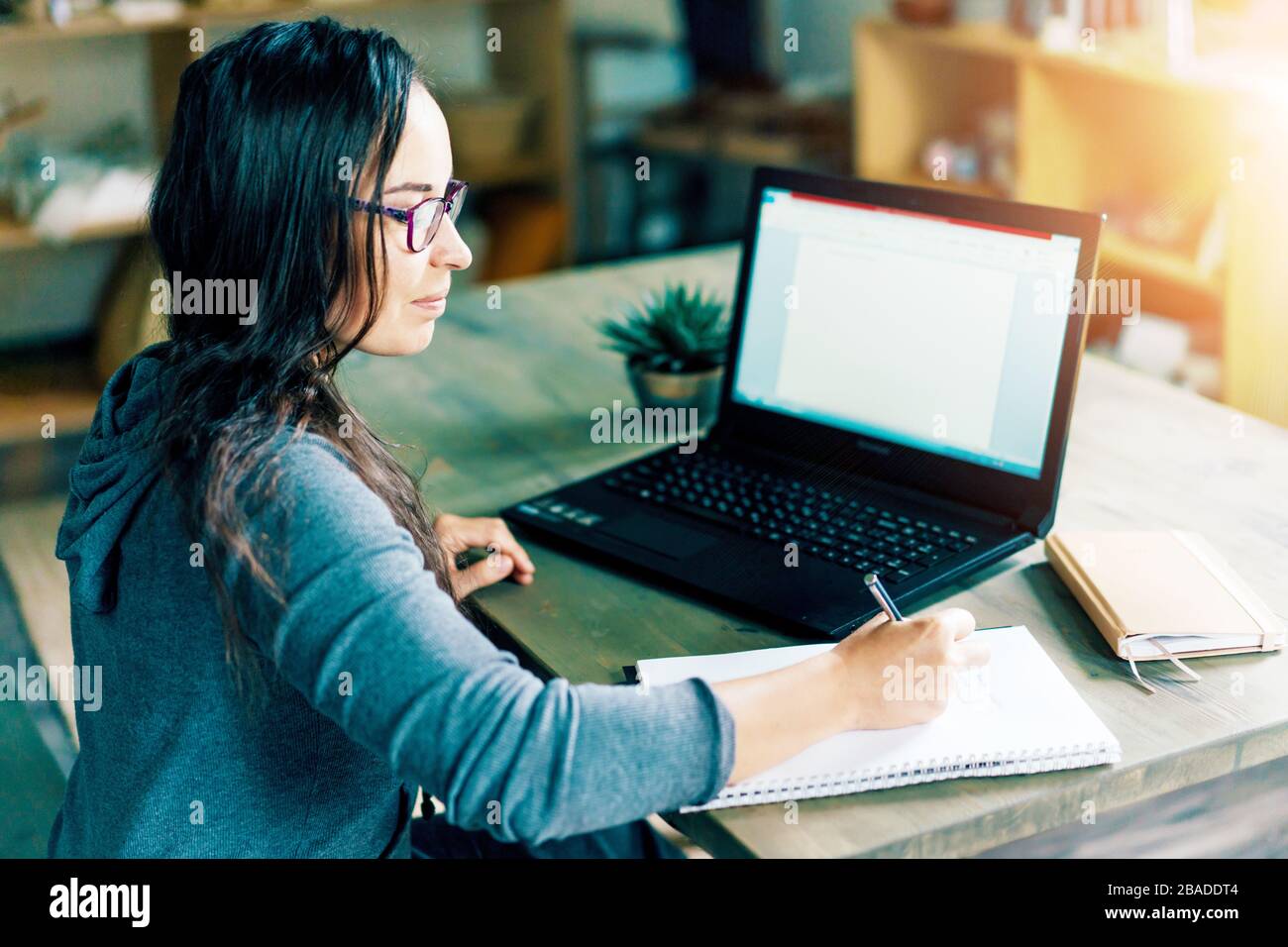 Beautiful girl writing in notebook hi-res stock photography and images ...
