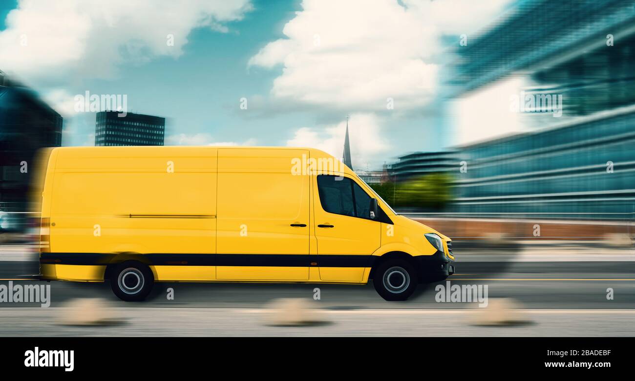 Fast mail and parcel delivery, yellow mail car in a modern city. With ...