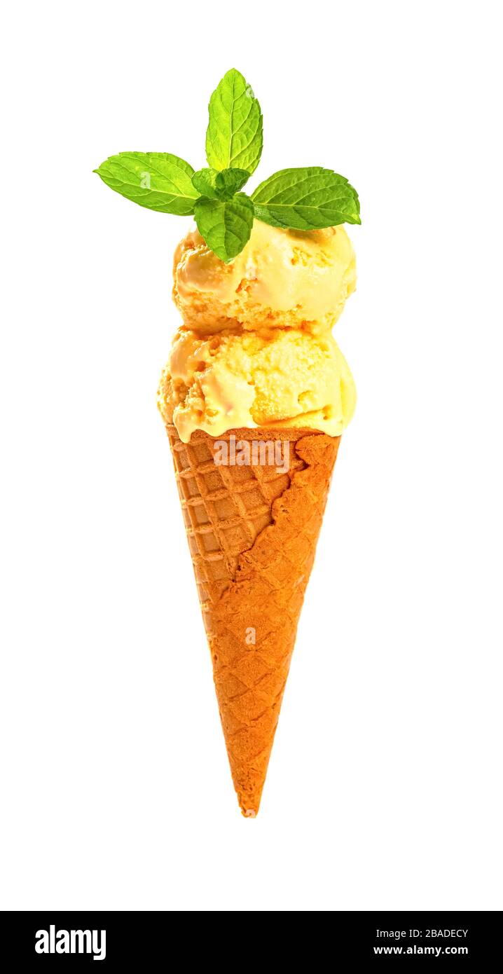 mango flavor ice cream cone with two balls with fresh leaves on white ...