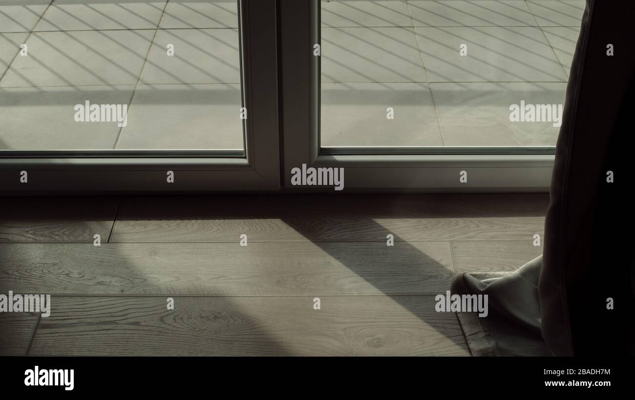 Sunlight shining through a window on to a wooden floor Stock Photo - Alamy