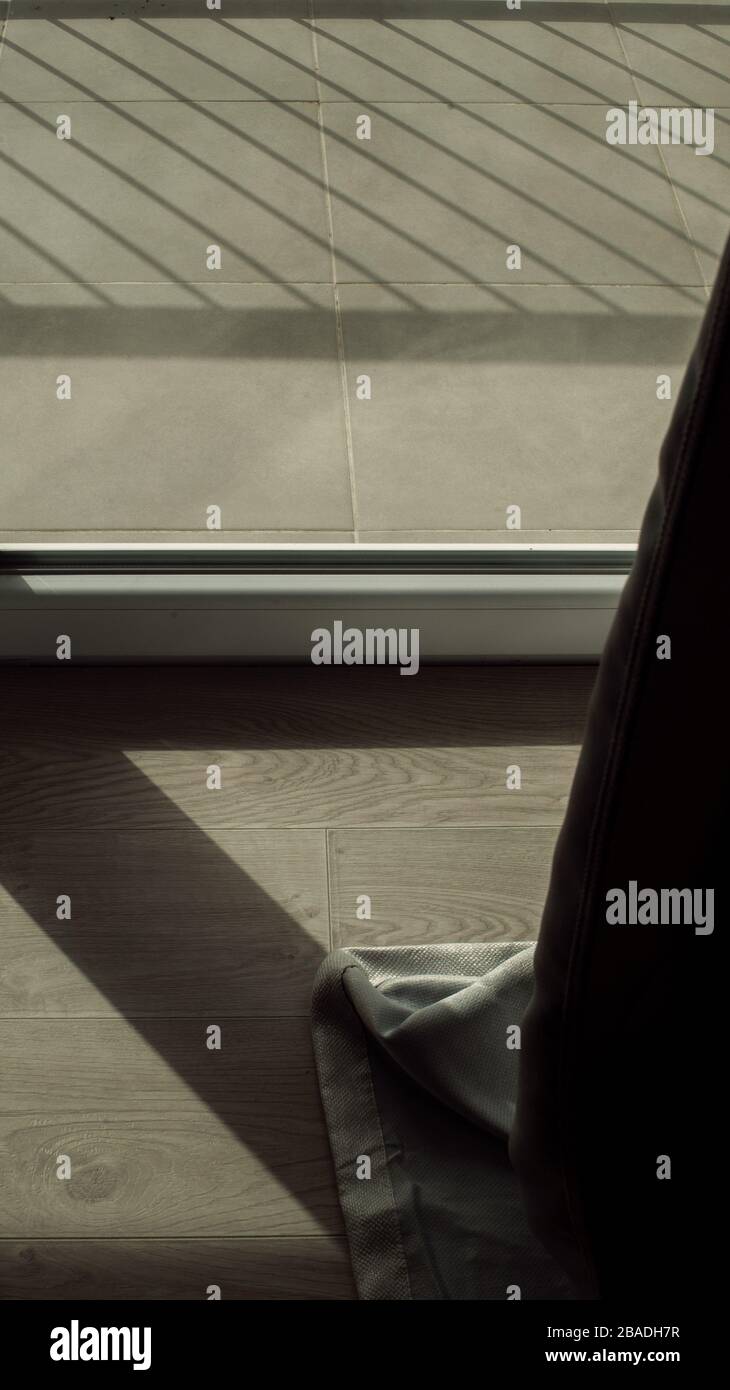 Sunlight shining through a window on to a wooden floor Stock Photo - Alamy