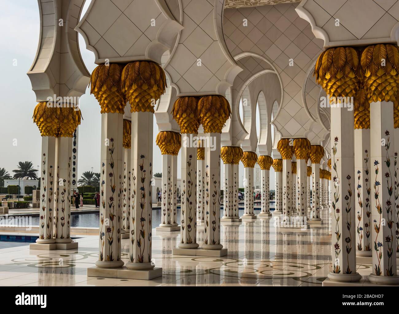 The arcades of the Sheikh Zayed Grand Mosque flanked by thousands of ...