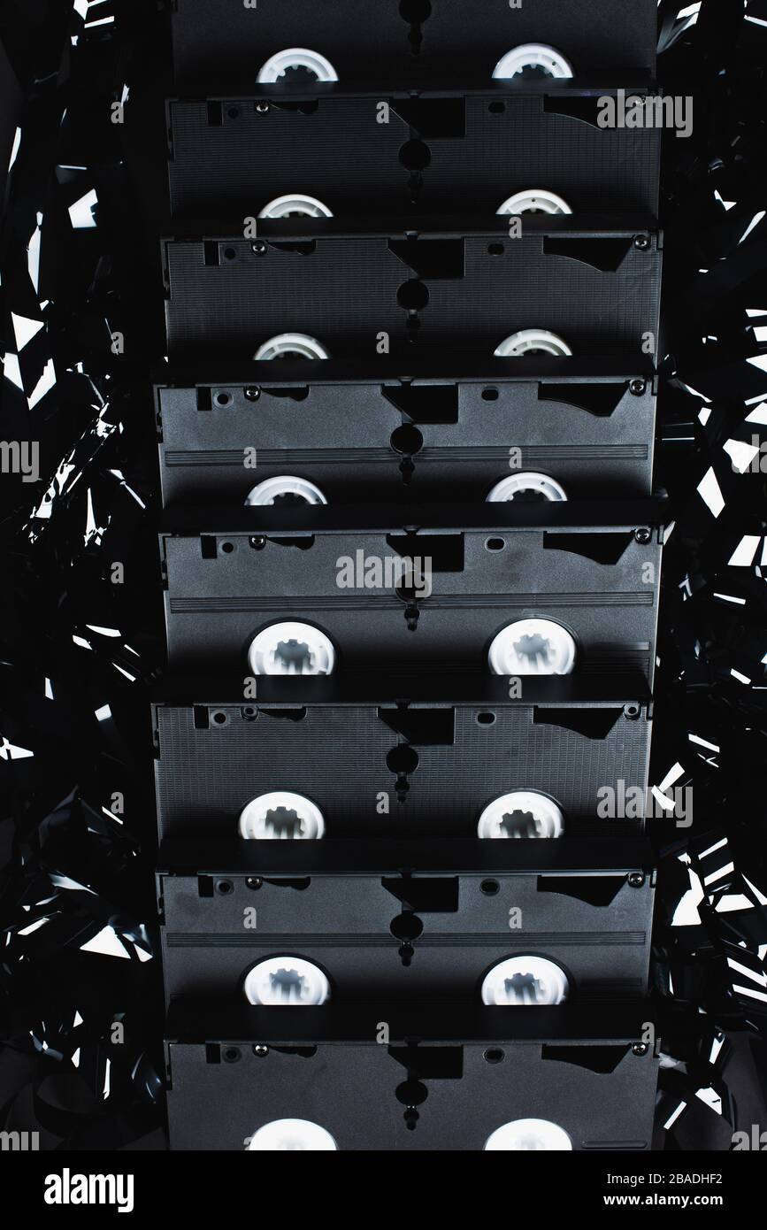 top view of VHS cassettes on black film strip Stock Photo - Alamy