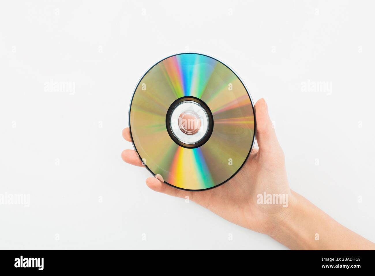 partial view of man holding CD disc on white background Stock Photo - Alamy