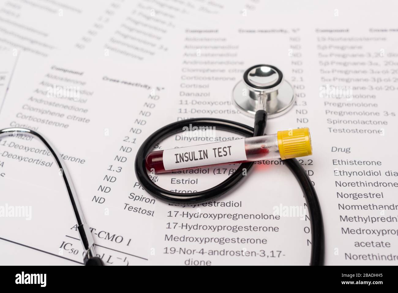 Close up view of stethoscope and test tube with insulin test lettering ...