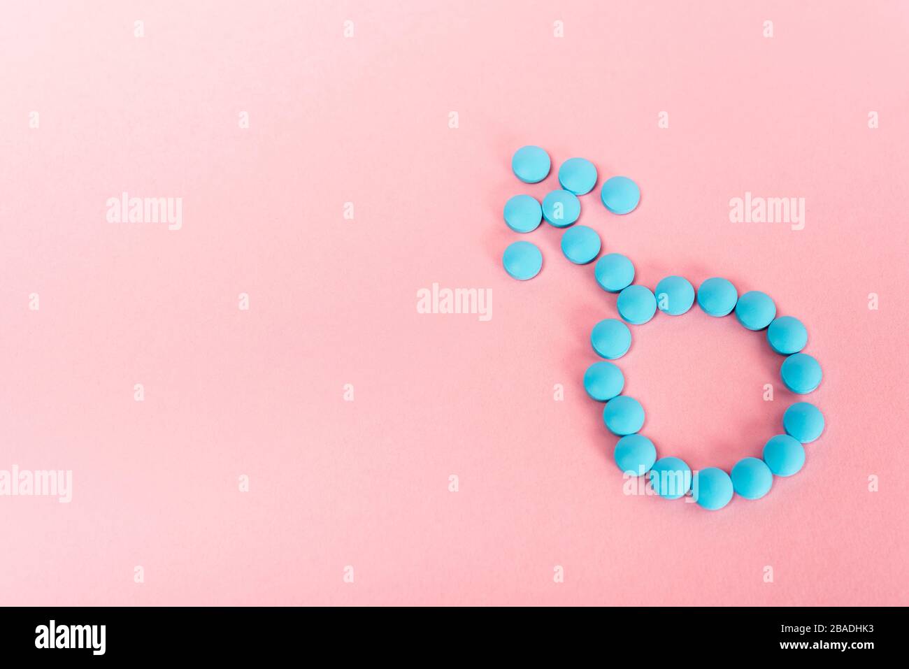 Top view of male sign from hormonal pills on pink background Stock ...