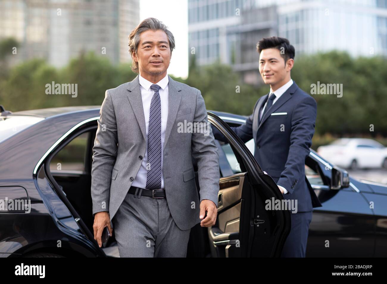 Businessman getting out of car hi-res stock photography and images - Alamy