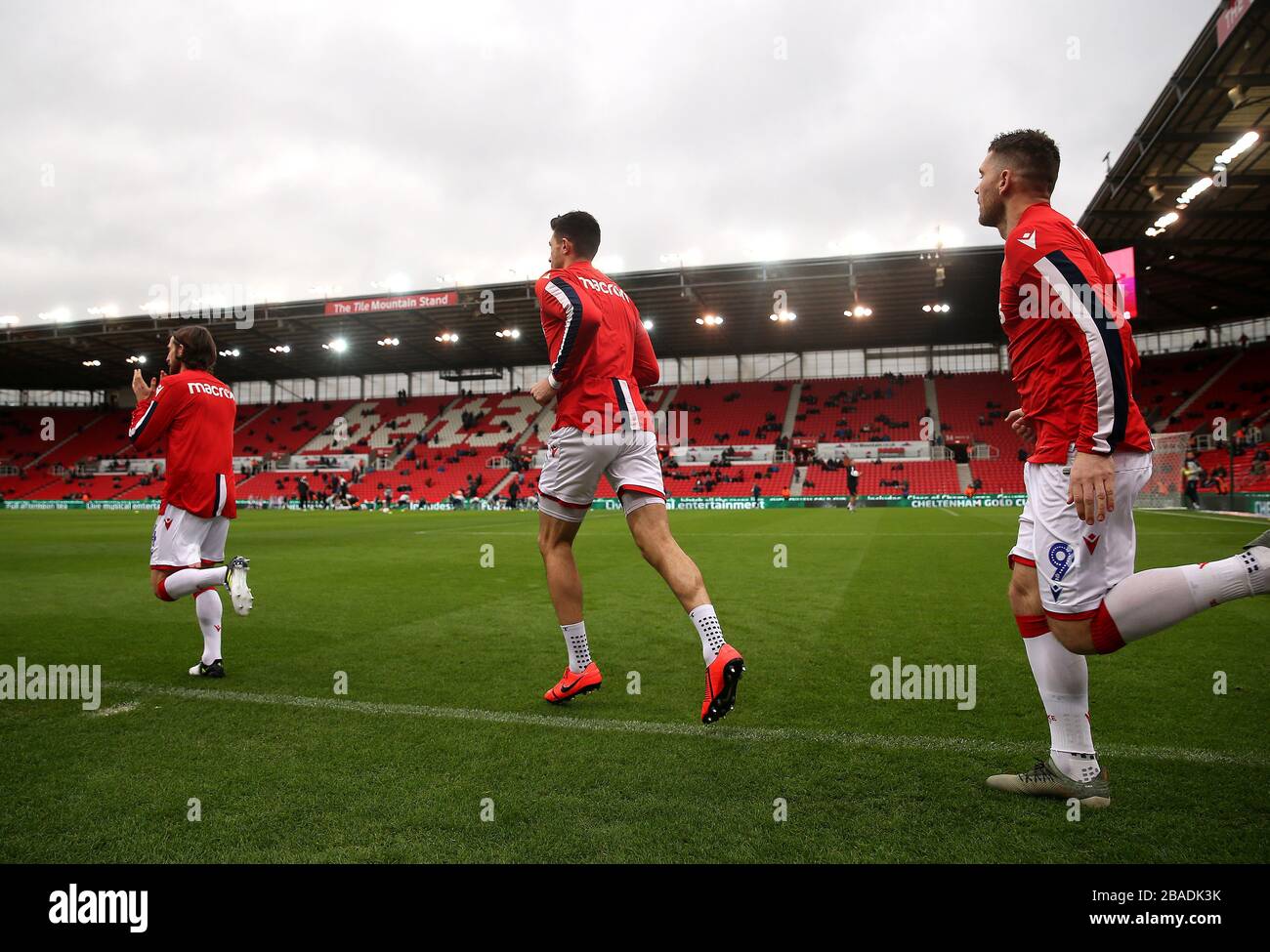 Stoke City's players run out for the warm up against Millwall's before ...