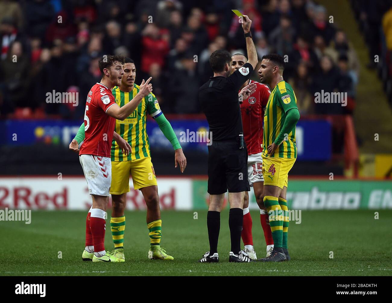 West Bromwich Albion's Kyle Bartley (right) is booked by referee Jarred ...