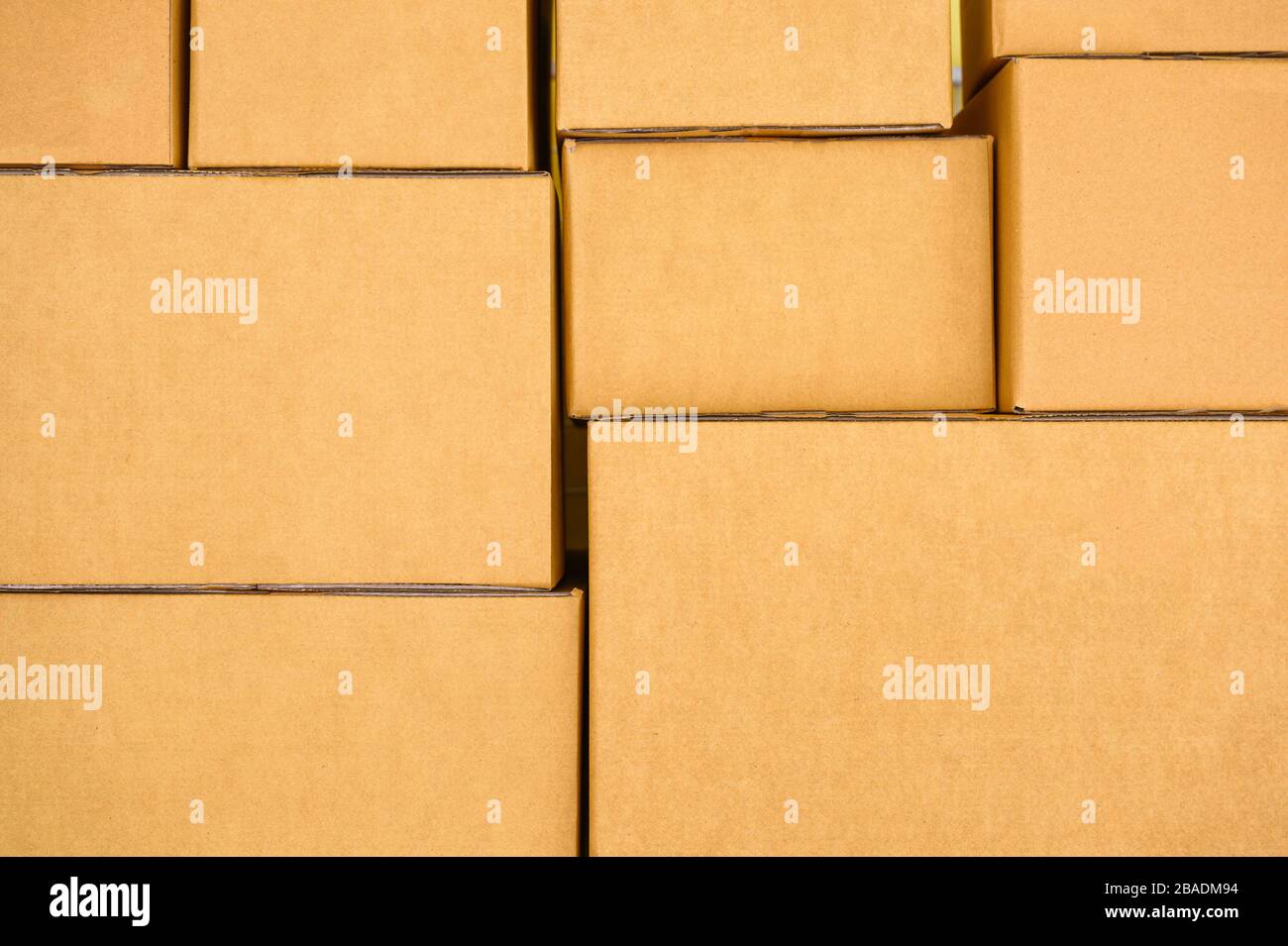 Stacked brown parcel box various size background Stock Photo - Alamy