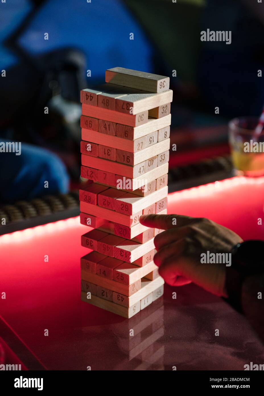 Finger playing the tower of wooden blocks game on the table Stock Photo ...