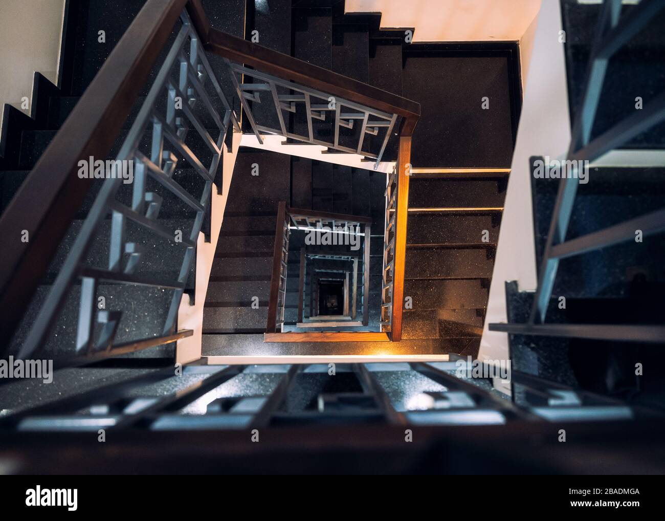 Top view, Frame square of vintage spiral staircase with light shiny in ...