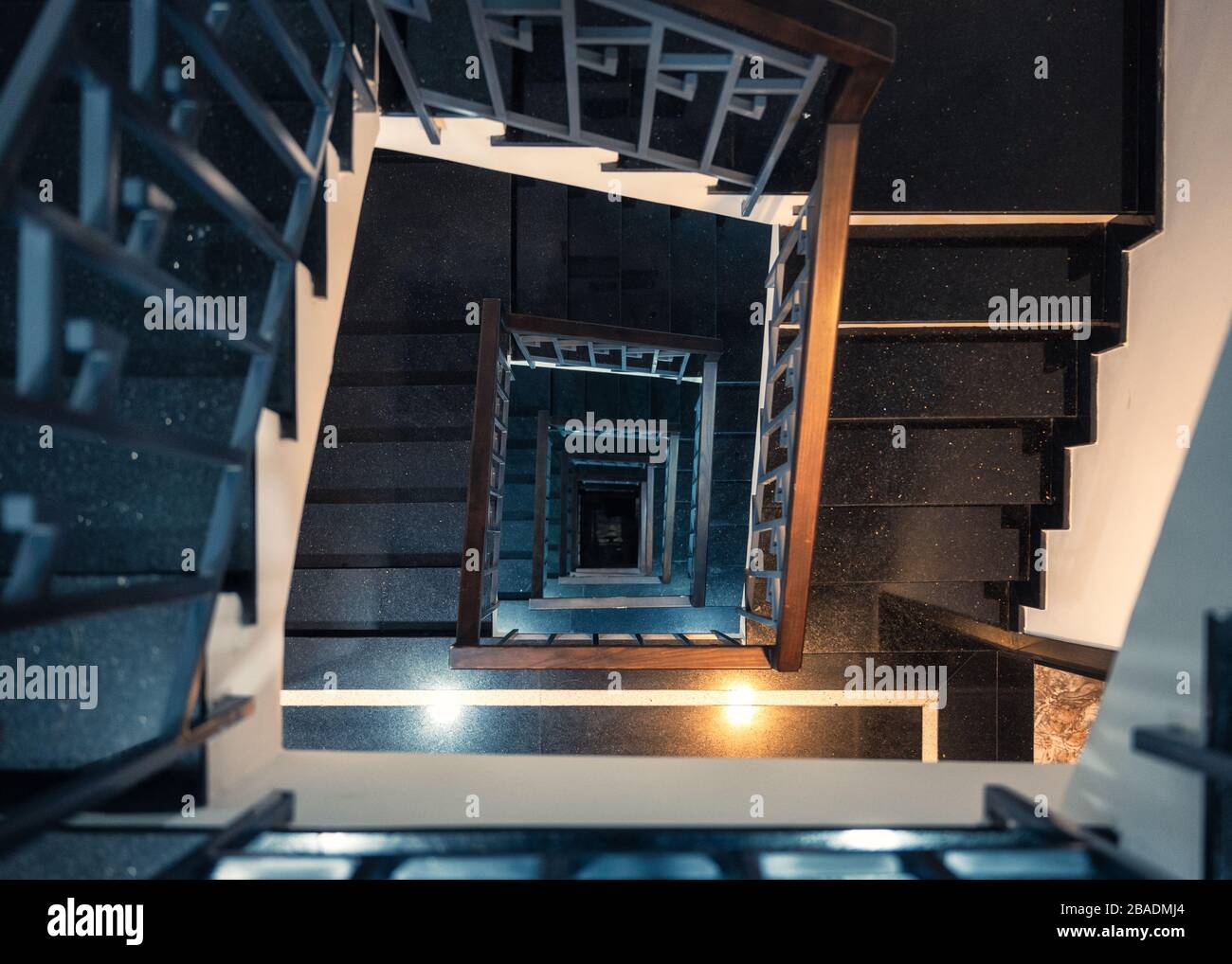 Top view, Frame square of vintage spiral staircase with light shiny in ...