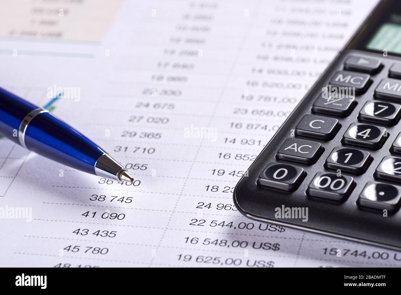 Office paper with table of numbers. Price analysis with dollar symbol ...