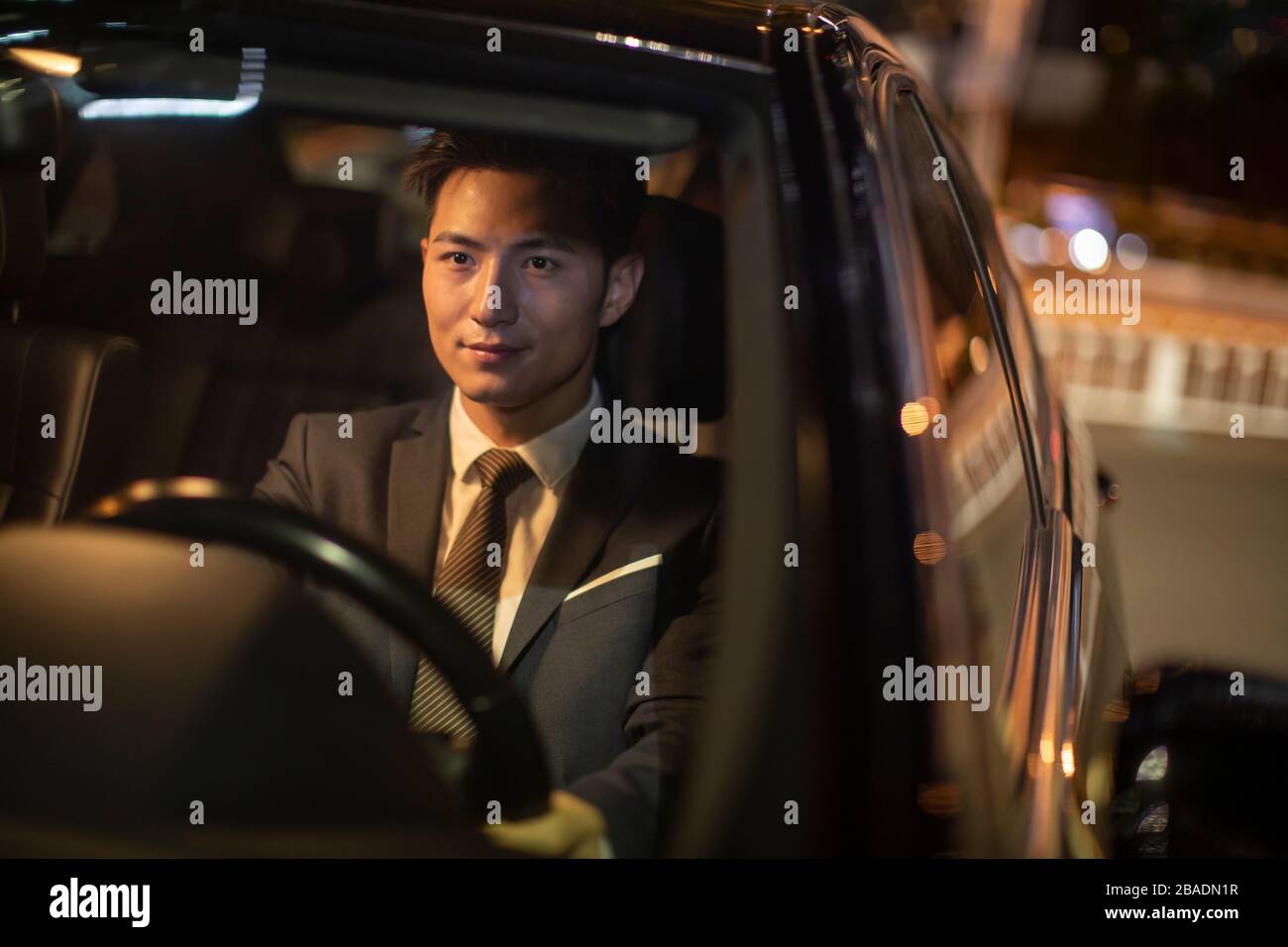 Successful Chinese businessman driving car Stock Photo - Alamy